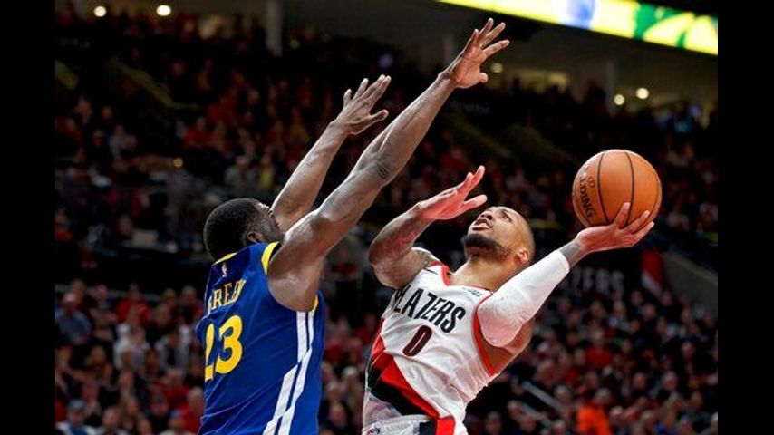 Lillard says he has separated ribs, will play through pain