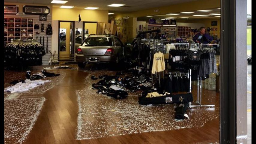 Photos: Car smashes through storefront at northshore business